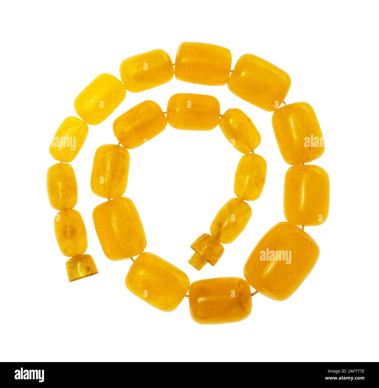 top view of spiral vintage necklace from yellow melted amber isolated ...