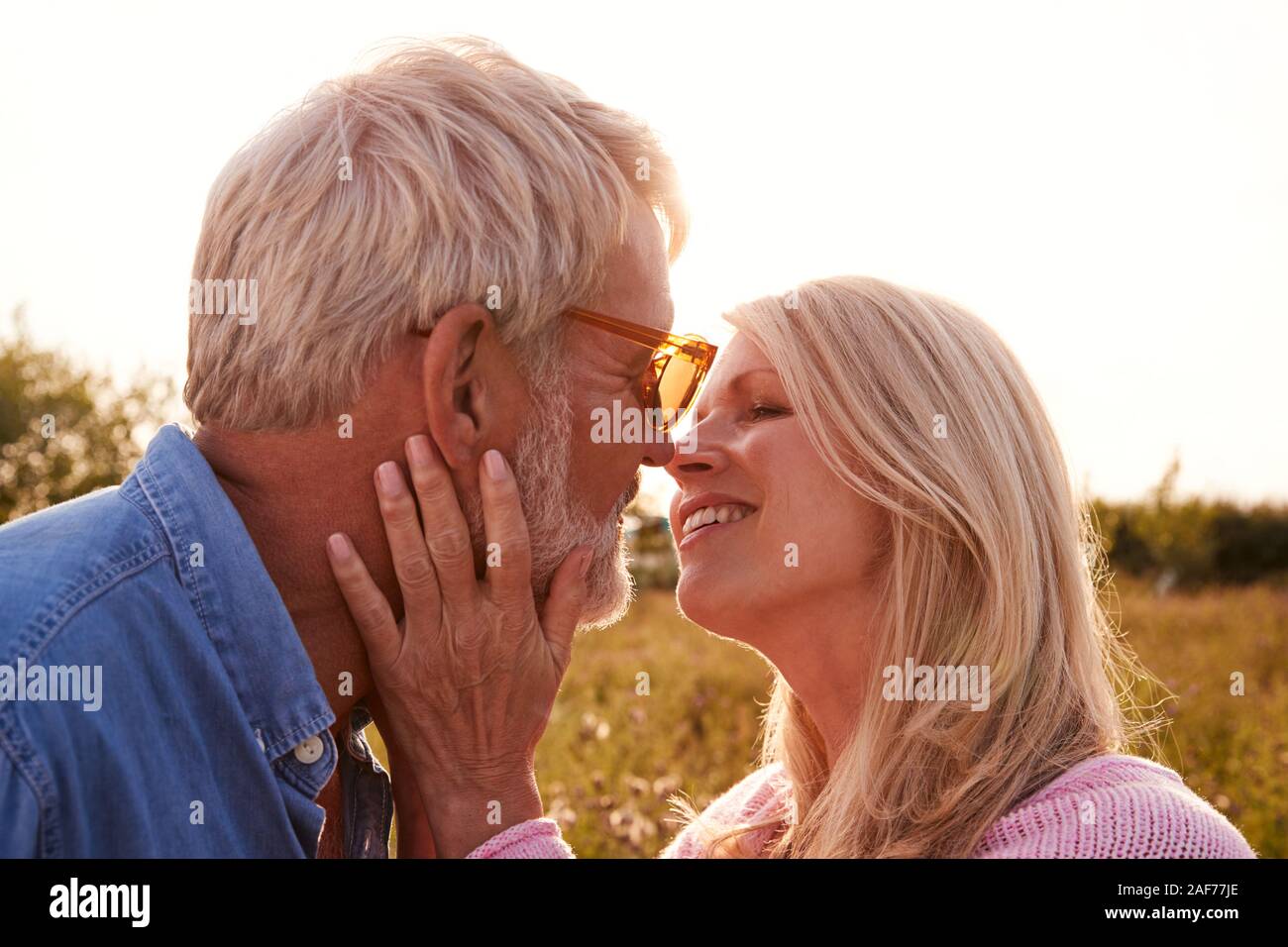 Loving relaxed couple kissing in hi-res stock photography and images ...