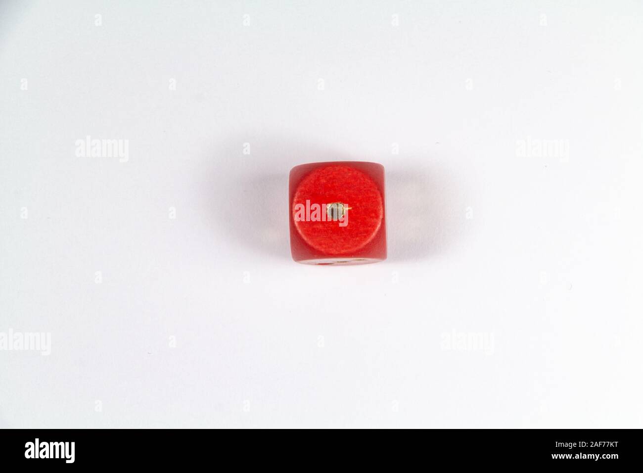 Red dice on number one on white background Stock Photo - Alamy