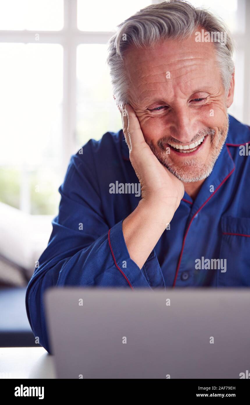 Mature Man Having Online Consultation With Doctor At Home On Laptop ...