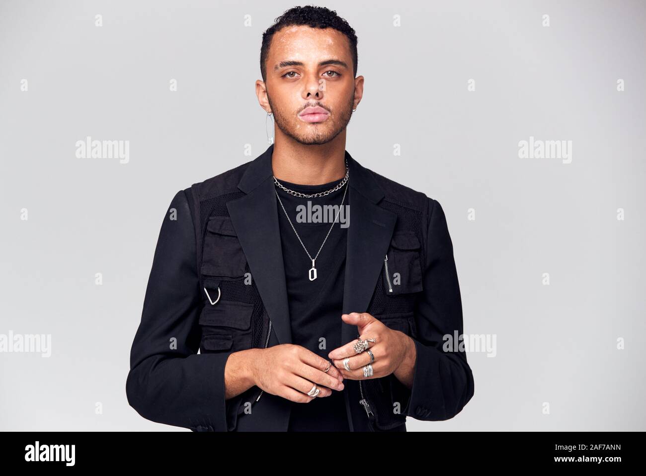 Studio Portrait Of Young Man With Skin Pigmentation Disorder Looking At ...