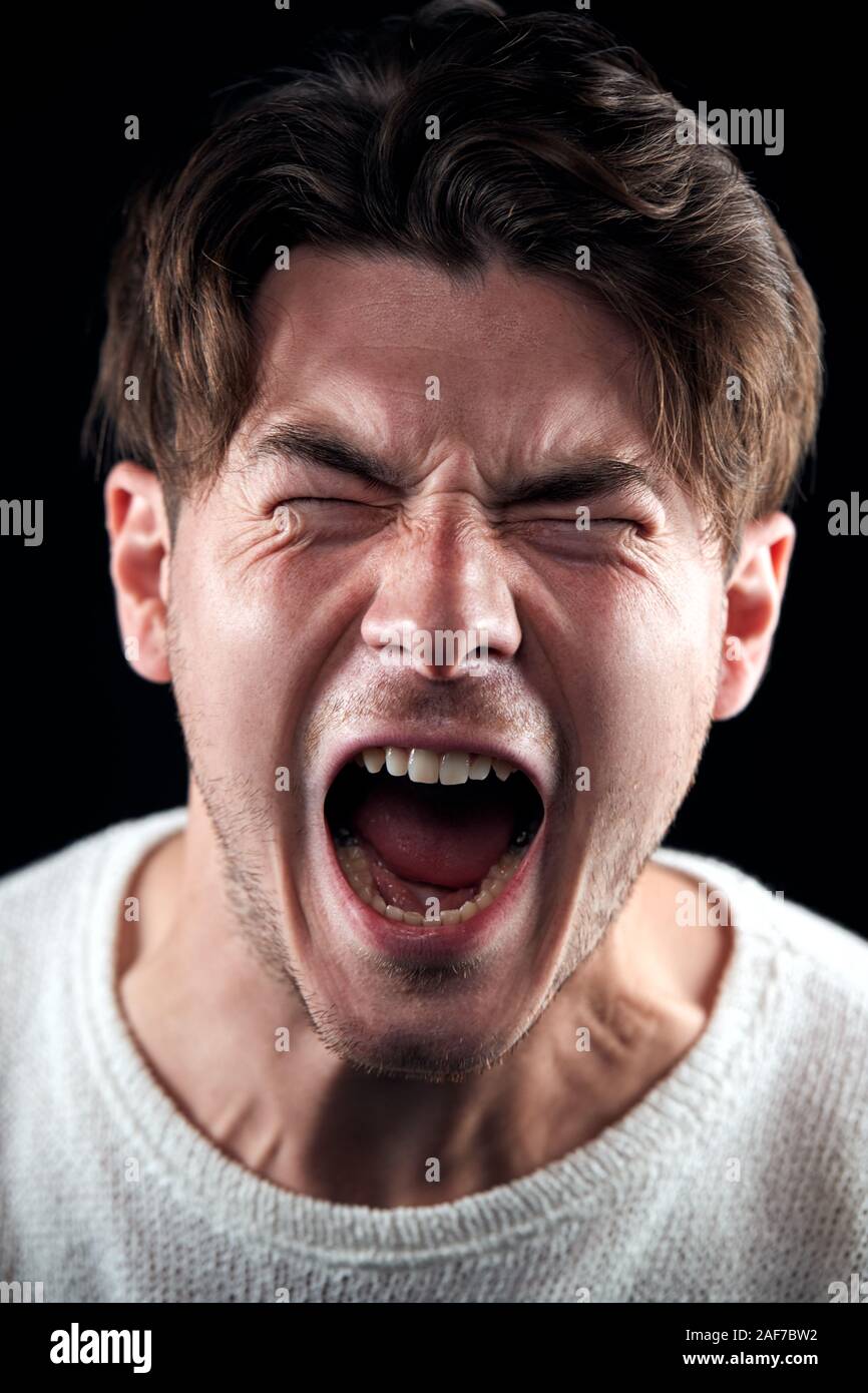 Head And Shoulders Studio Shot Of Angry Man Shouting At Camera Stock ...