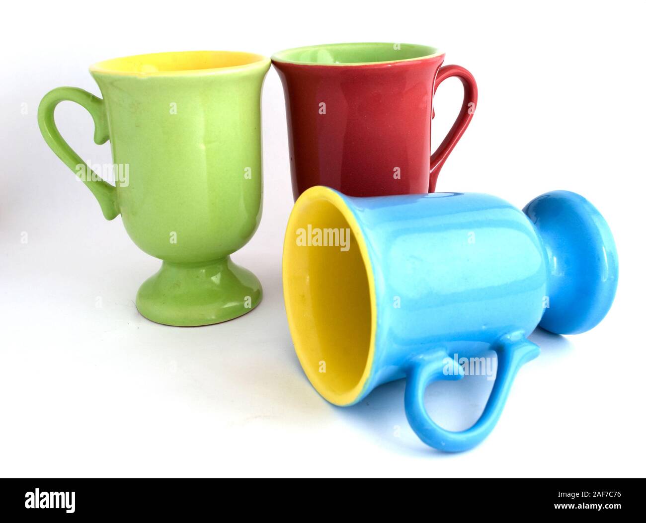 Three cups isolated on white background Stock Photo - Alamy