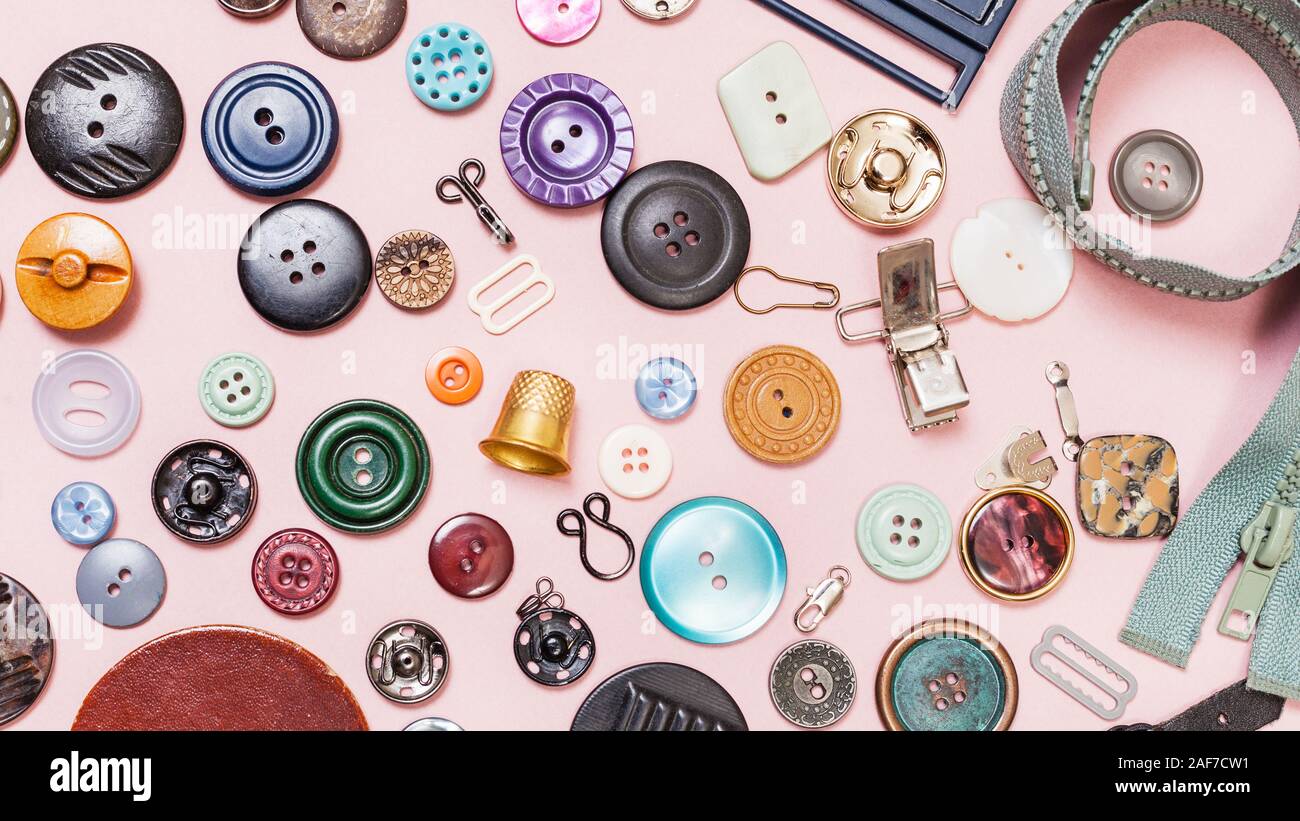 top view of many various sewing objects on pink background Stock Photo ...