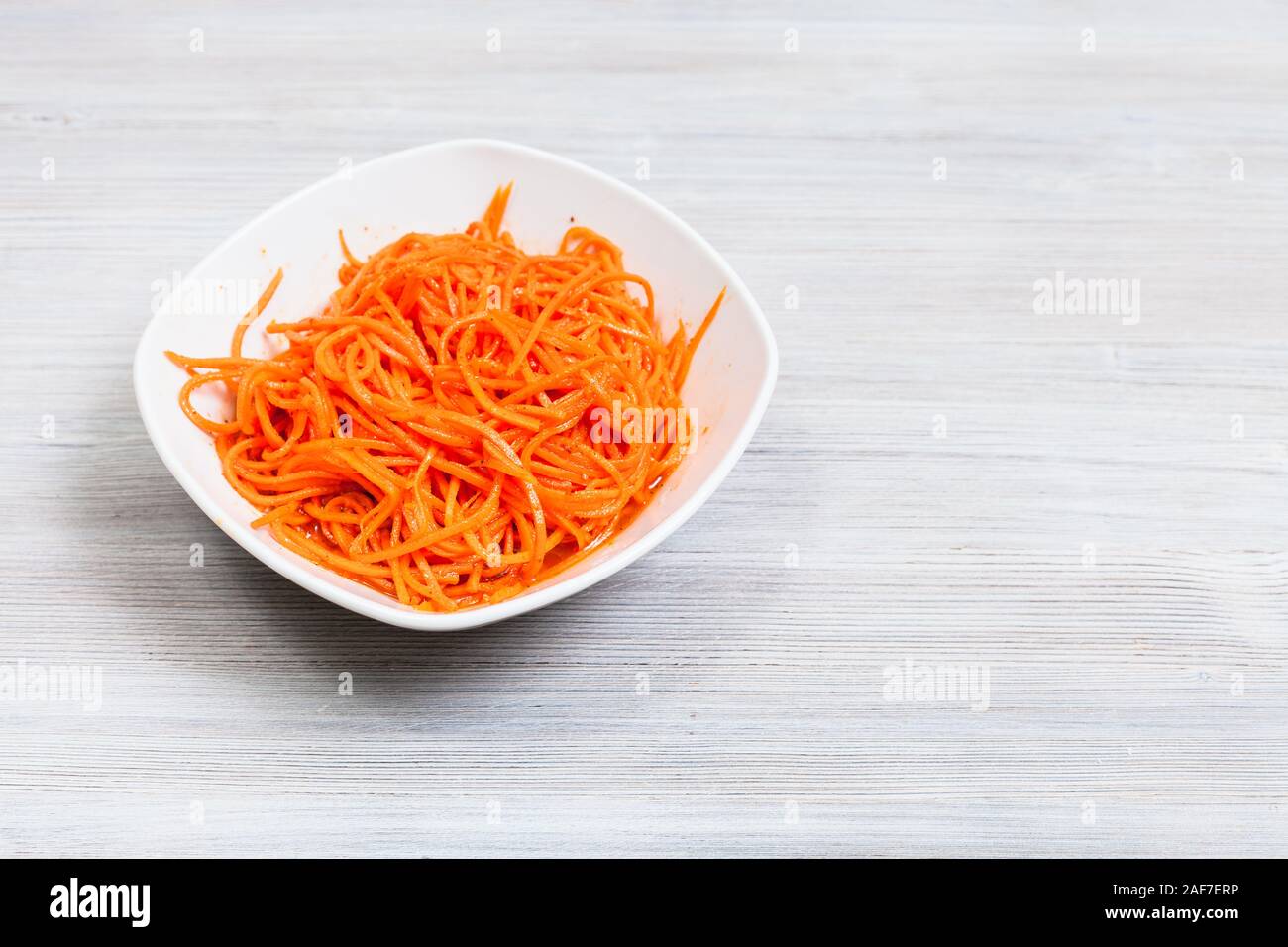 Korean-style carrots ( Koryo-saram, spicy pickled carrot) in bowl on ...