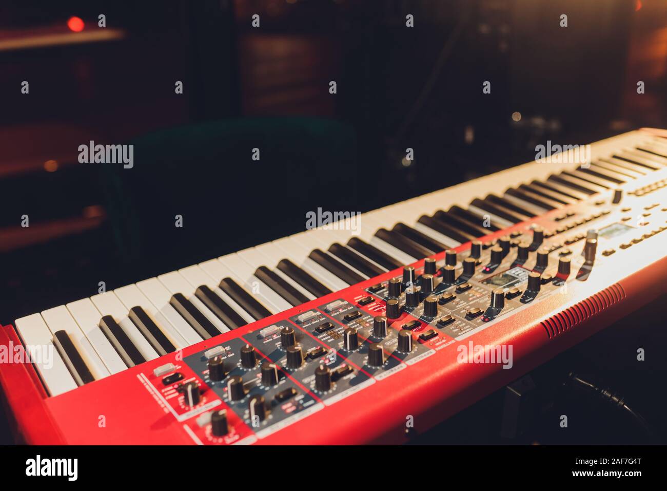 Musician playing on the keyboard synthesizer piano keys. Musician plays ...