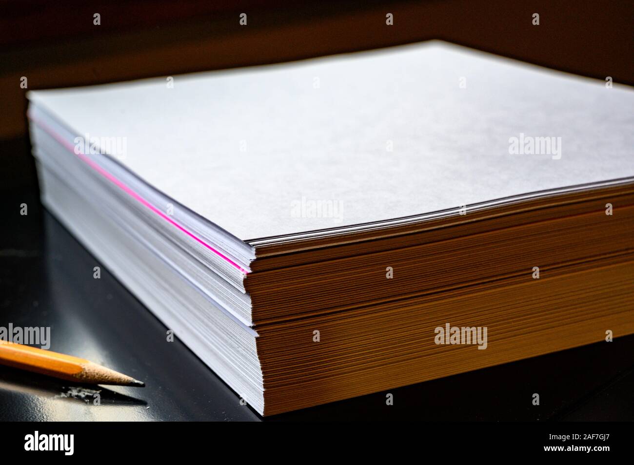 Single colored sheet in a stack of plain white paper Stock Photo - Alamy