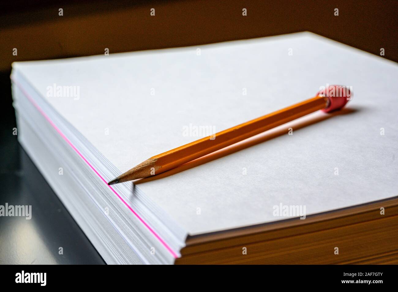 Single colored sheet in a stack of plain white paper Stock Photo - Alamy