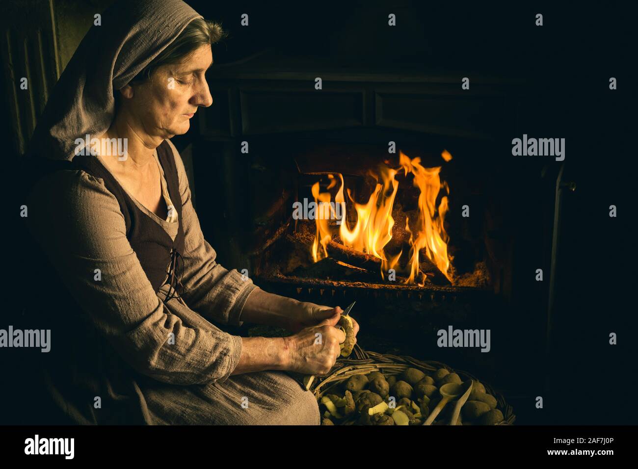 Renaissance old master portrait of a peasant woman peeling potatoes at ...