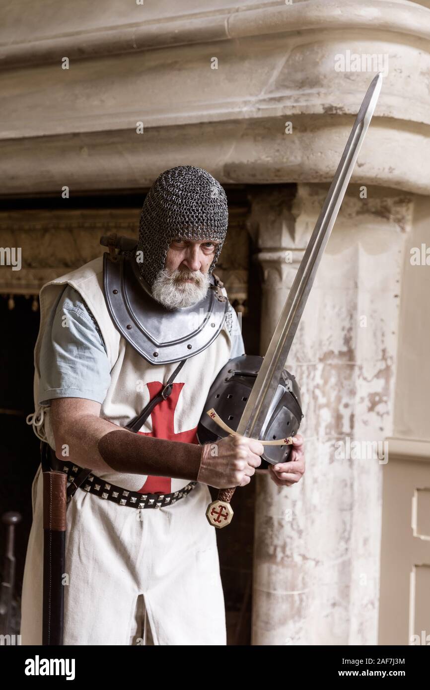 Authentic knight in medieval crusader outfit with helmet, chainmail and ...