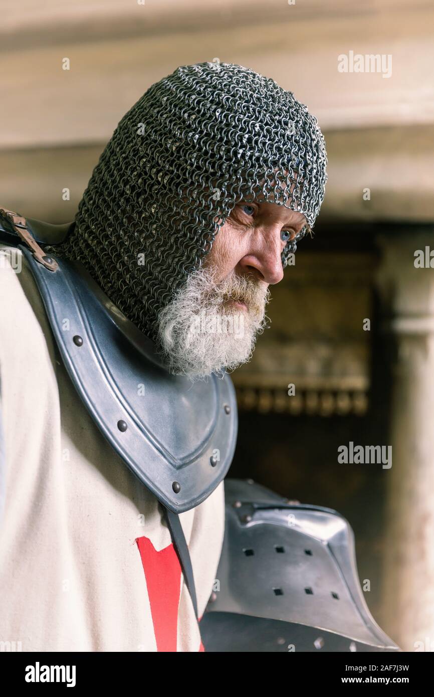 Authentic knight in medieval crusader outfit with helmet, chainmail and ...