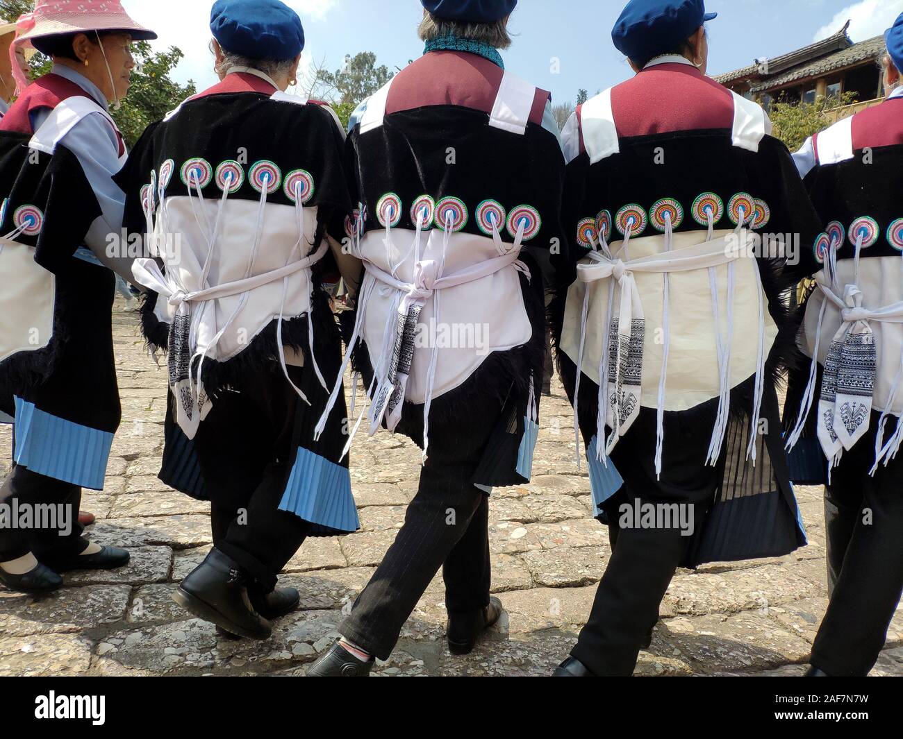 March 16, 2019: Women dancing in traditional costume of the Naxi ethnic ...