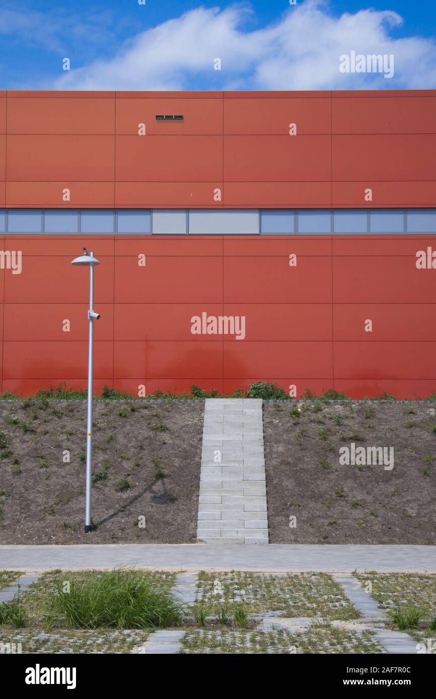 Blue red green sky building grass Stock Photo - Alamy