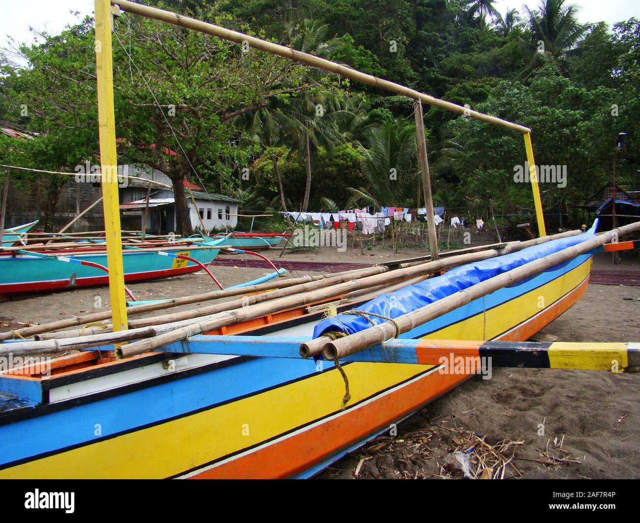Bangkas (or bankas), traditional outrigger wooden boats used by the ...