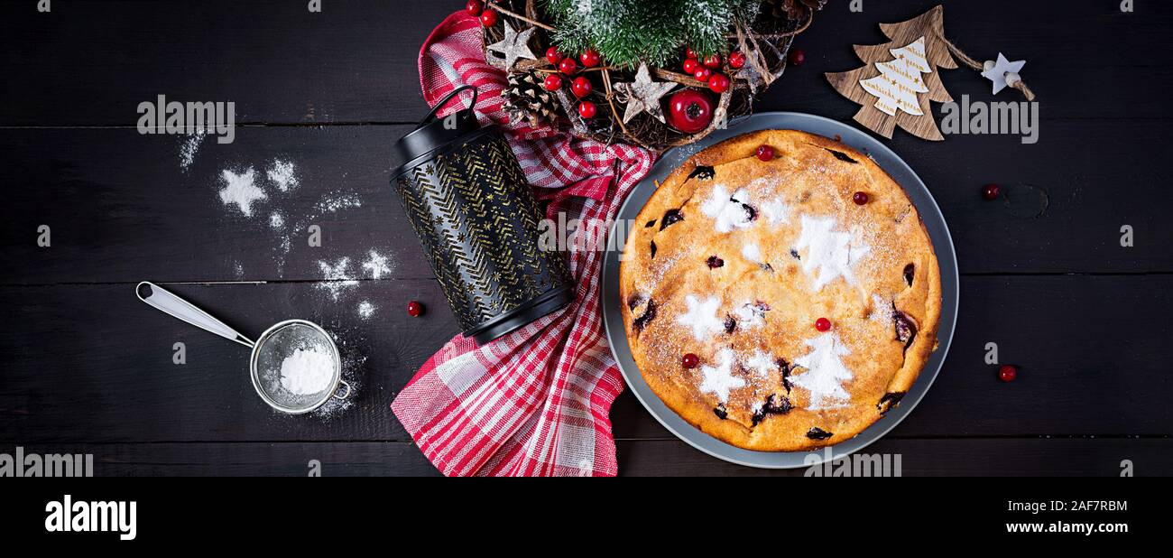 Christmas fruit cake, pudding on dark table. Top view, overhead, banner ...