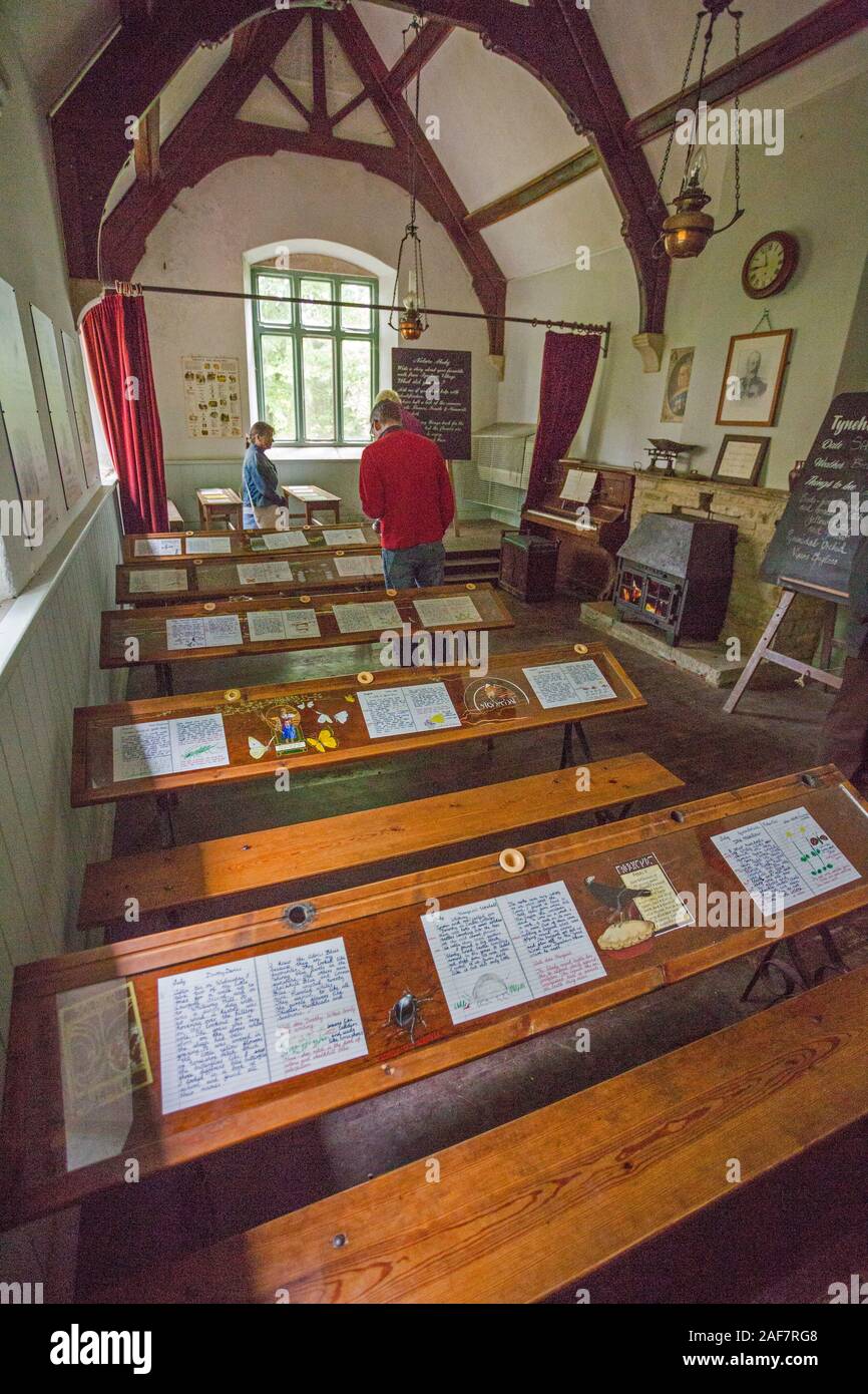The schoolroom interior has been preserved and examples of pupils' work ...