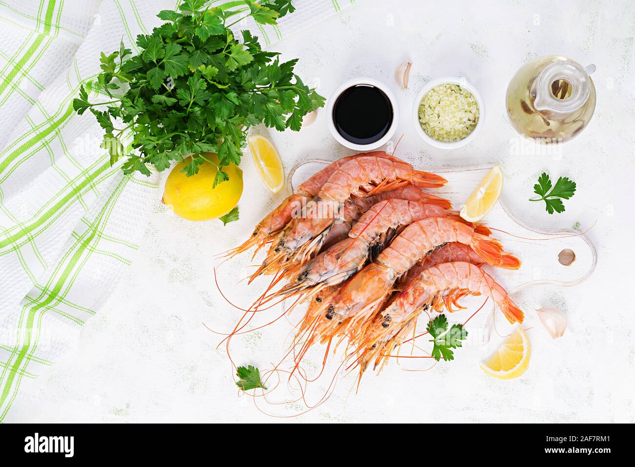 Raw wild Argentinian red shrimps/prawns and ingredients for cooking ...