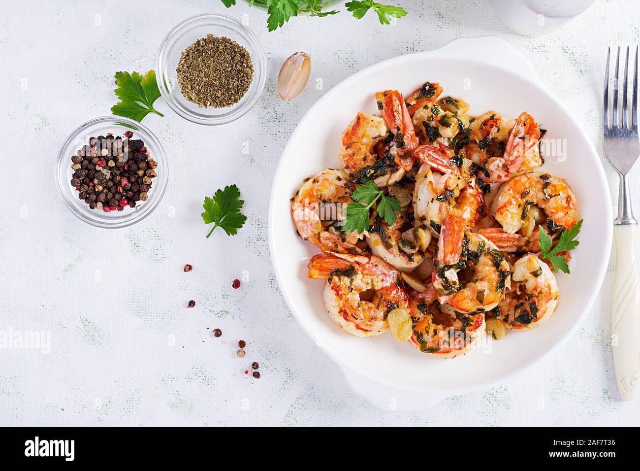 Grilled shrimps. King prawn tails in orange-garlic sauce with parsley ...