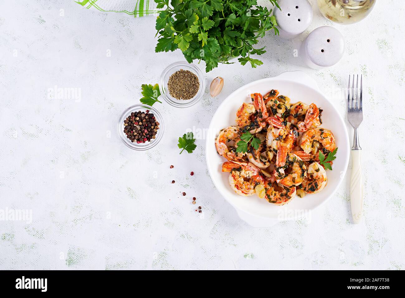 Grilled shrimps. King prawn tails in orange-garlic sauce with parsley ...