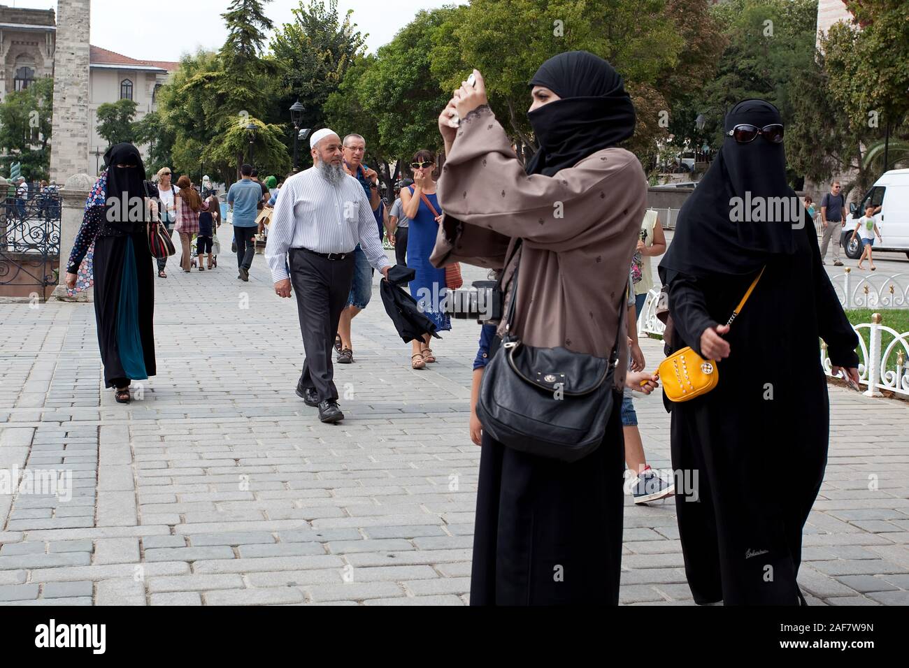 Islamic women makes a picture, ad the right a women wearing a hijab and ...