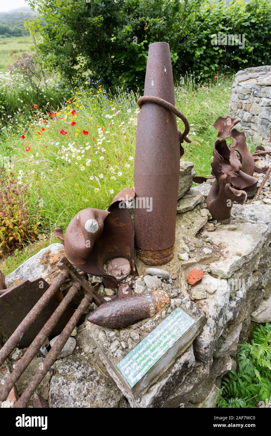 Assorted rusty shell cases and shrapnel used to build a wall in the ...