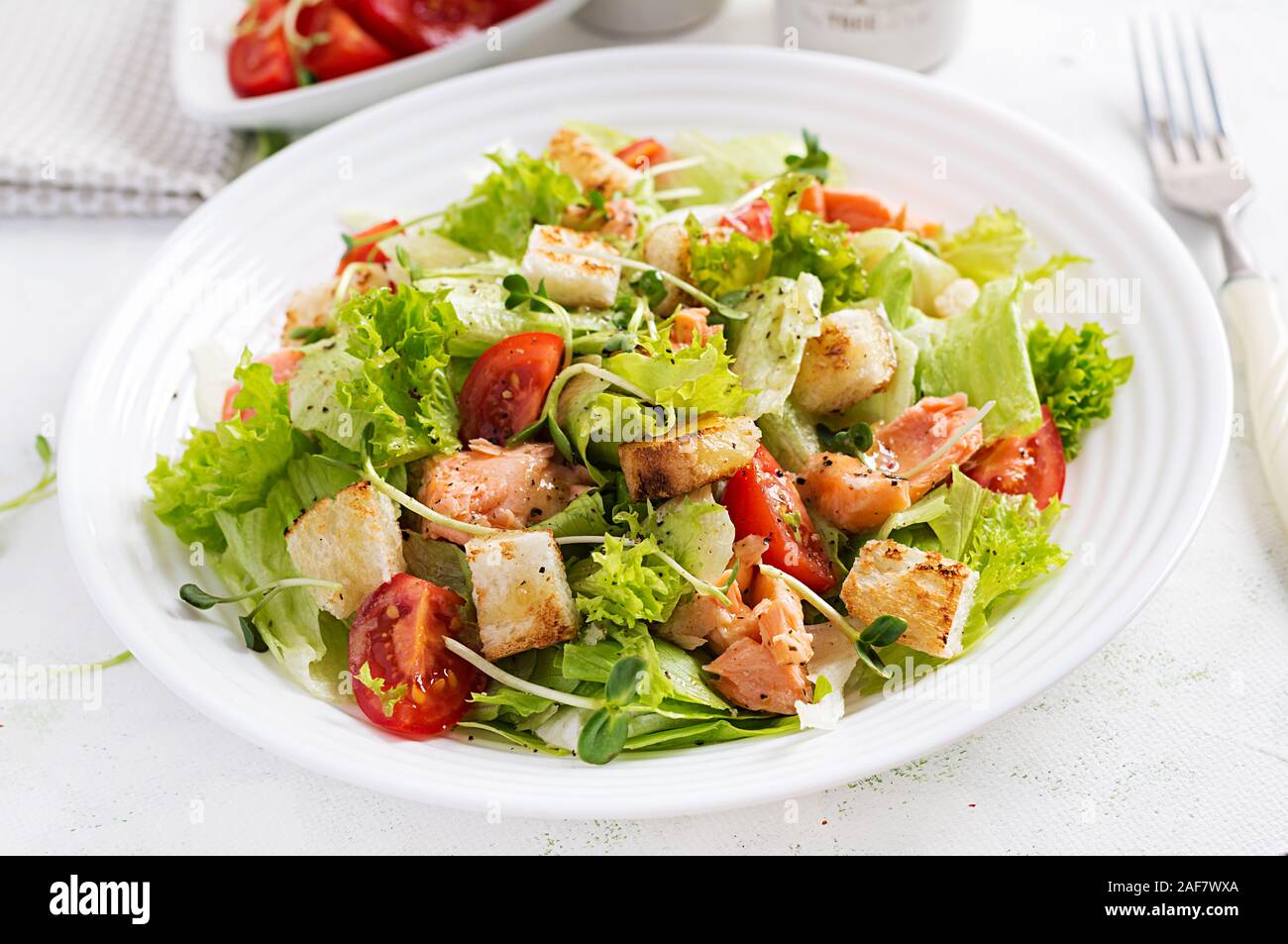 Caesar Salad with Salmon. Fish menu. Seafood - salmon Stock Photo - Alamy