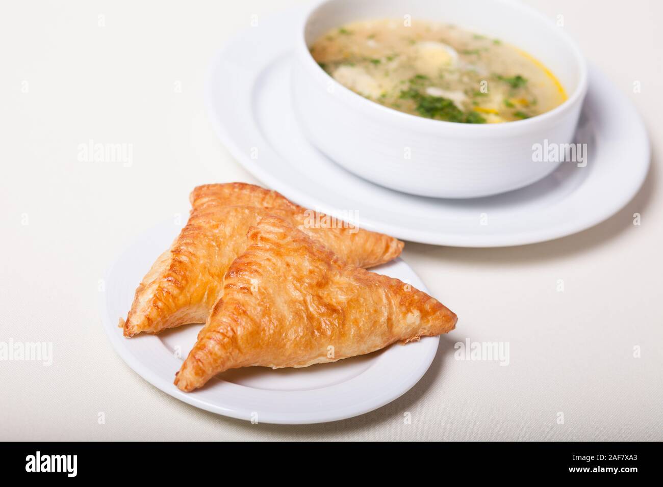 Chicken clear soup with puffs Stock Photo - Alamy