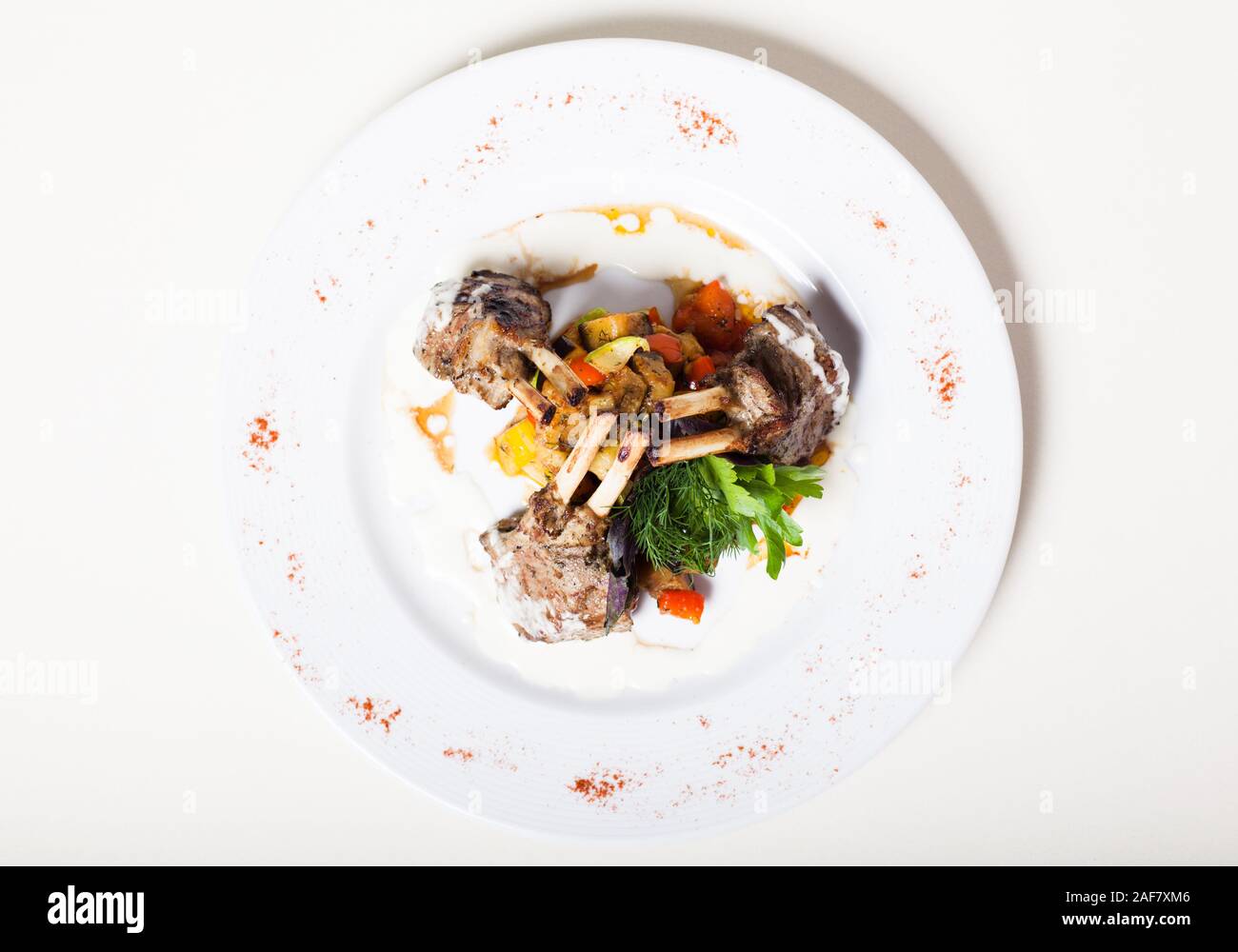 Grilled rack of lamb with cheese sauce and vegetable garnish Stock ...