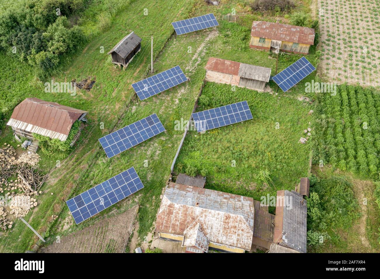 Aerial top down view of solar panels in green rural area Stock Photo ...
