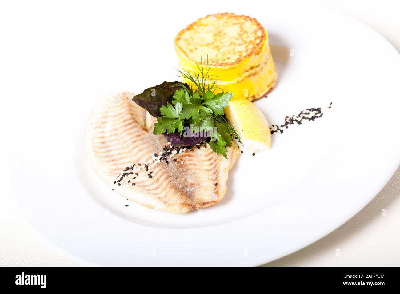 Steamed white fish with baked pudding Stock Photo - Alamy