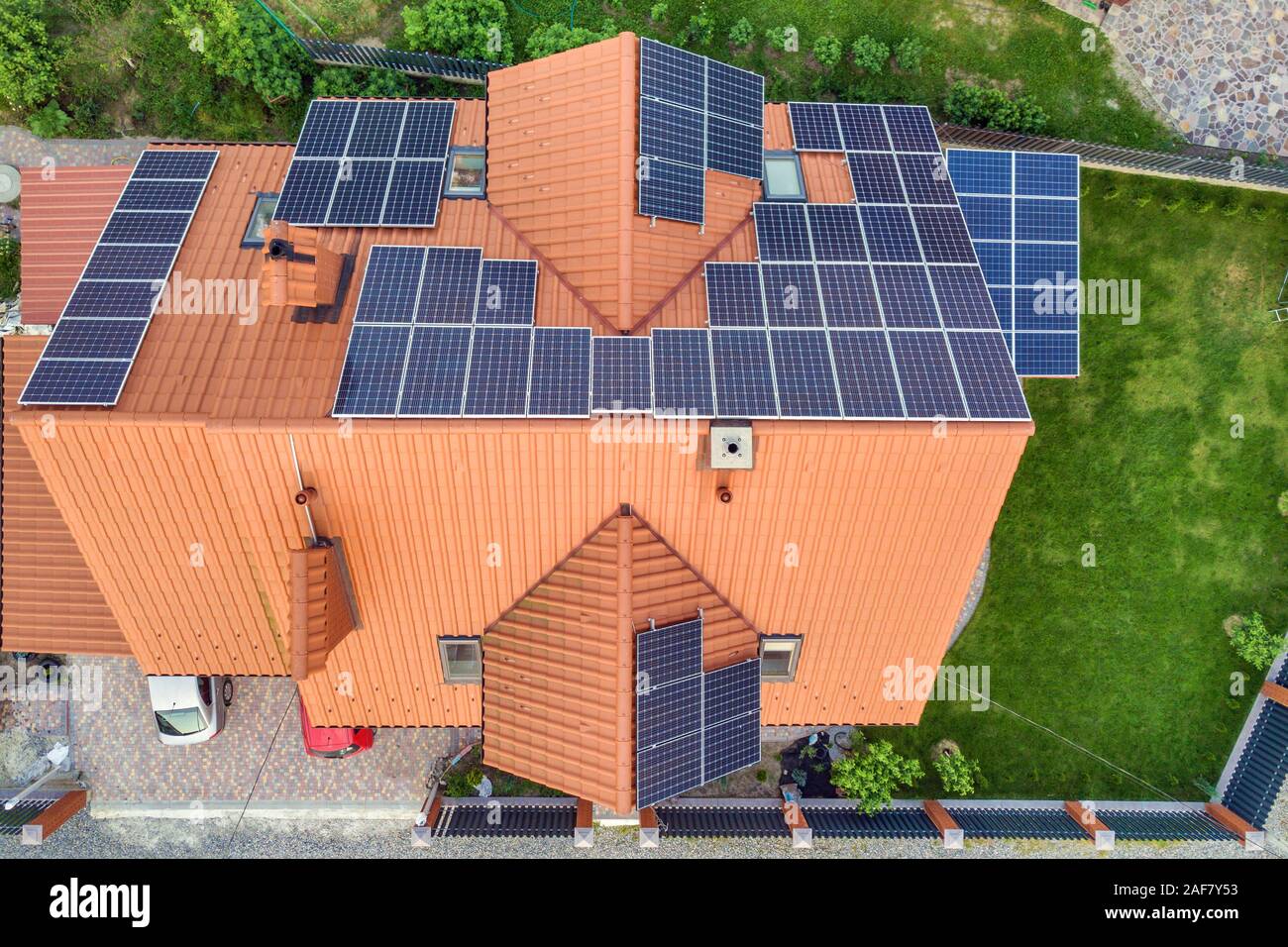 Aerial top view of new modern residential house cottage with blue shiny ...