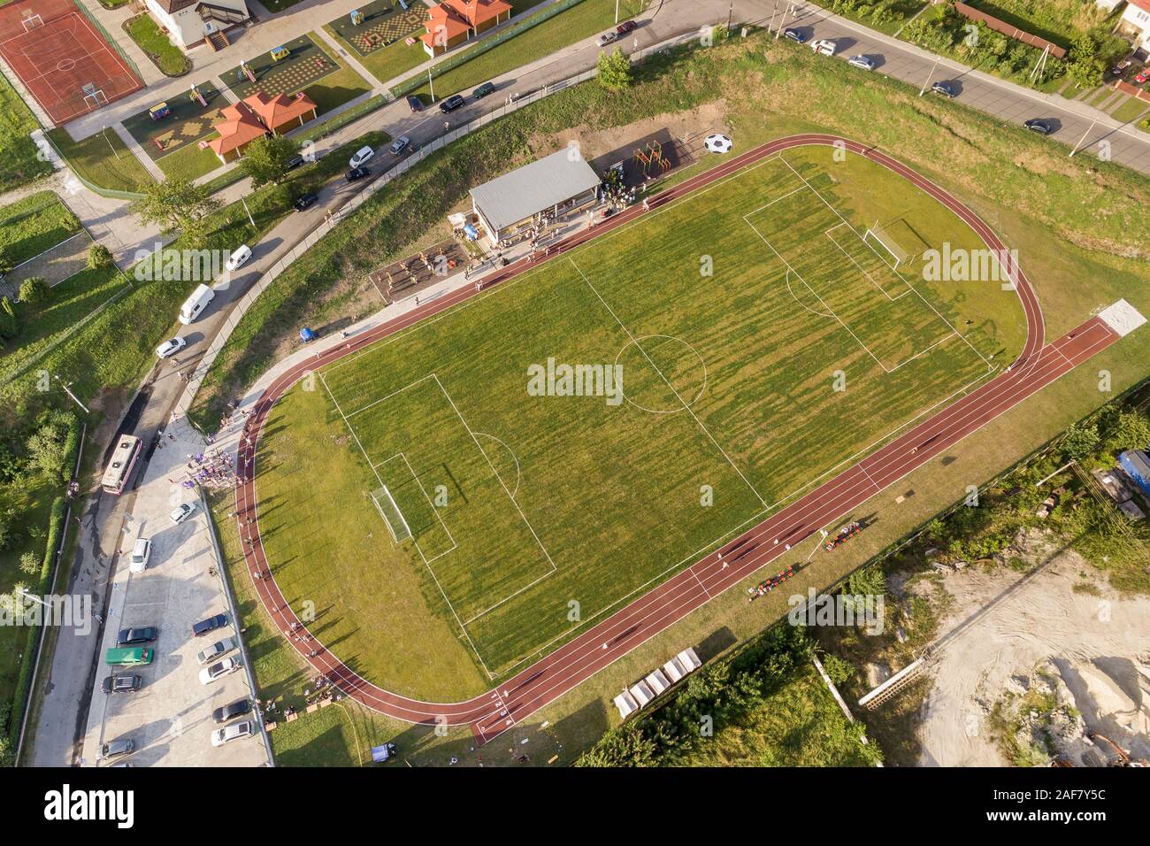 Aerial view of a football field on a stadium covered with green grass ...