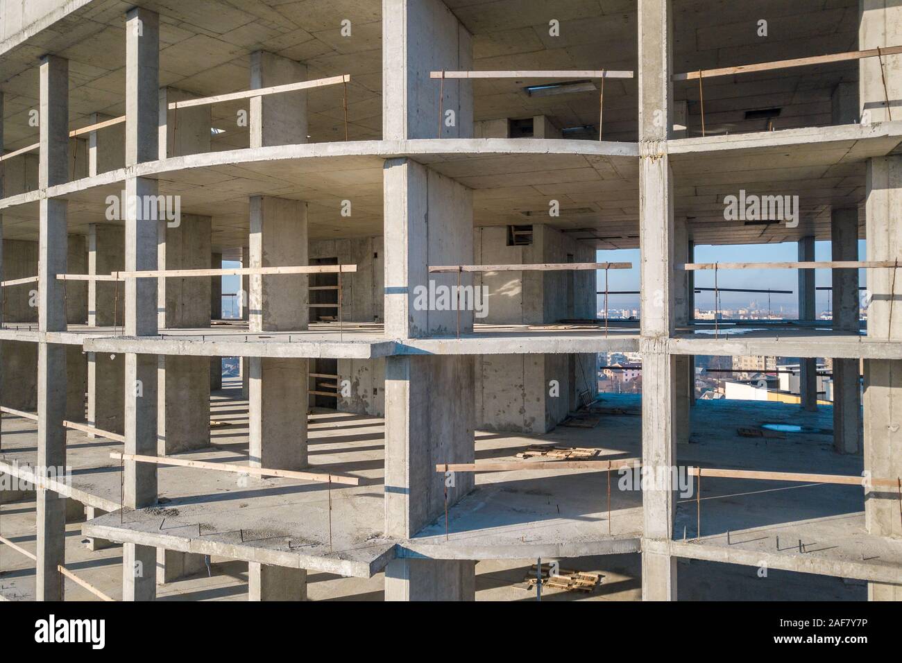 Aerial view of concrete frame of tall apartment building under ...