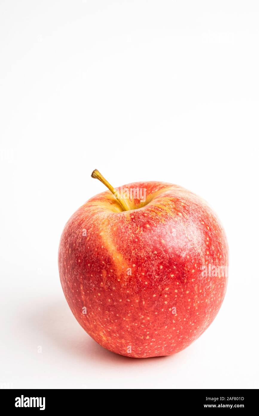 One fresh red apple isolated on a plain white background Stock Photo ...