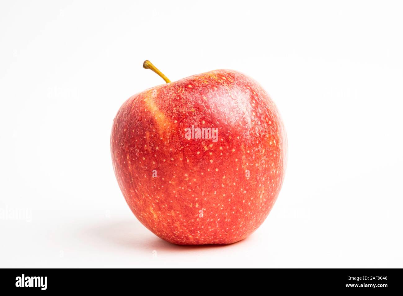 One fresh red apple isolated on a plain white background Stock Photo ...