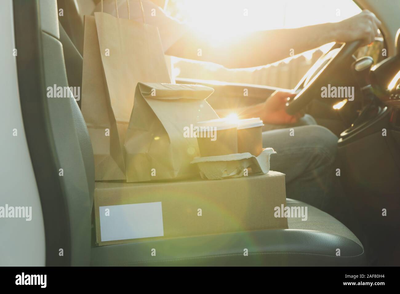 Attractive package delivery man hi-res stock photography and images - Alamy