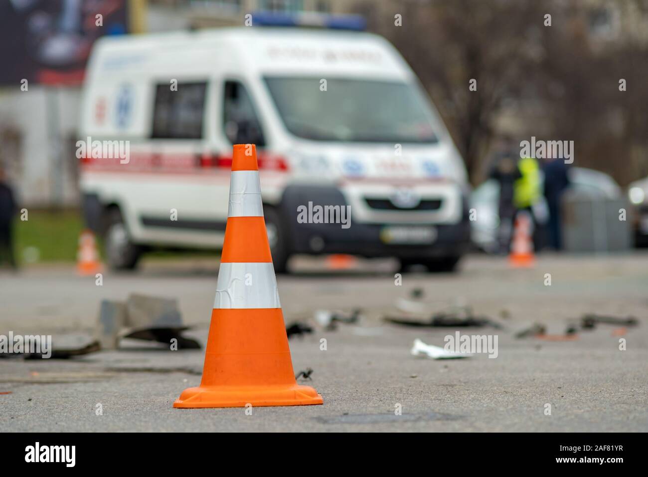 Yellow plastic cone placed on a street at car accident crash site Stock ...