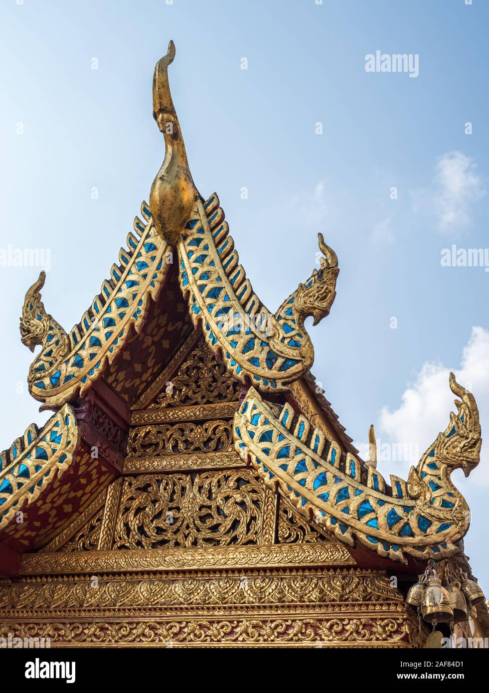 Carved floral pattern in the traditional Thai style on the gable of the ...