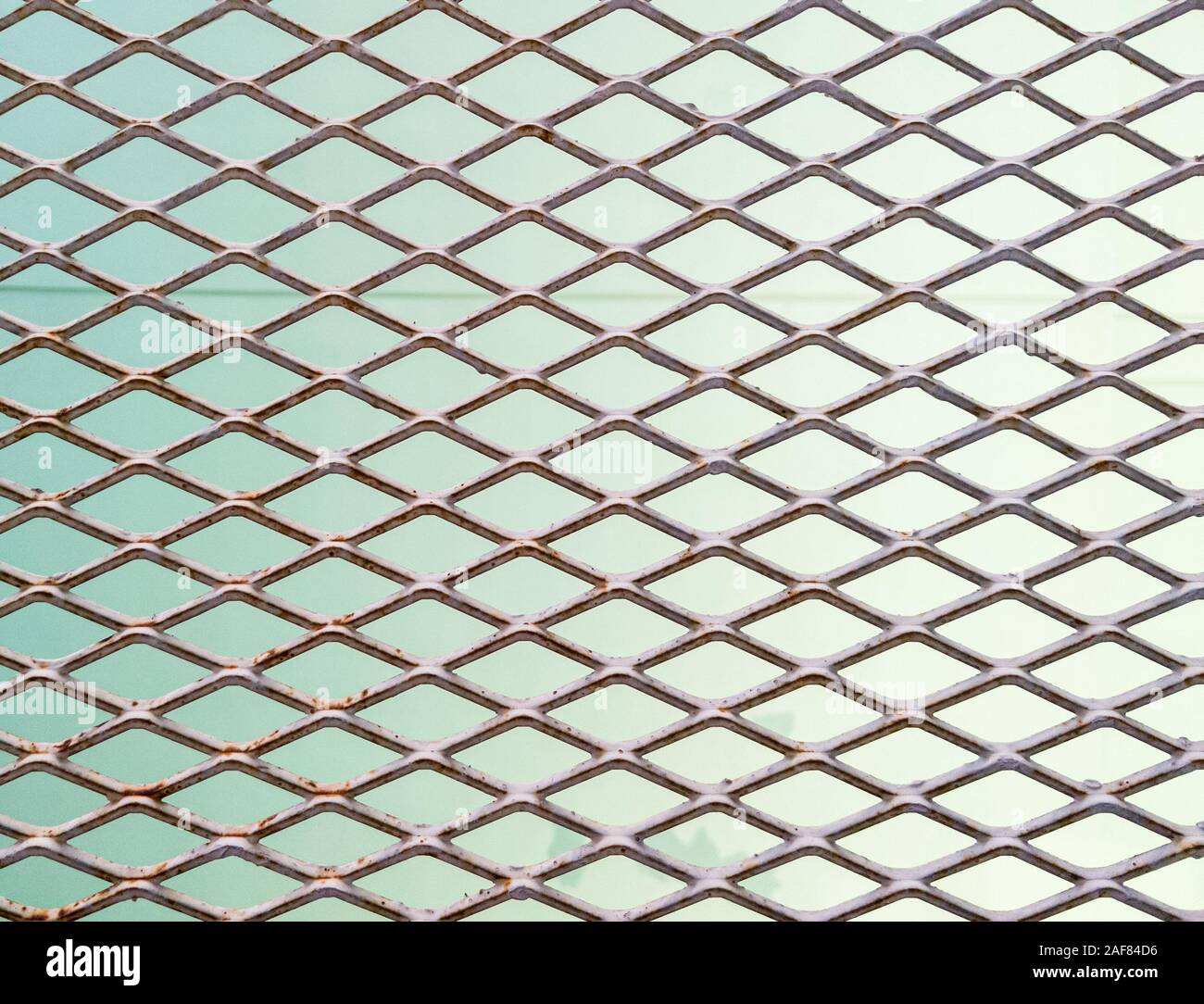 Metal mesh fence with the stain for protection on the high building ...