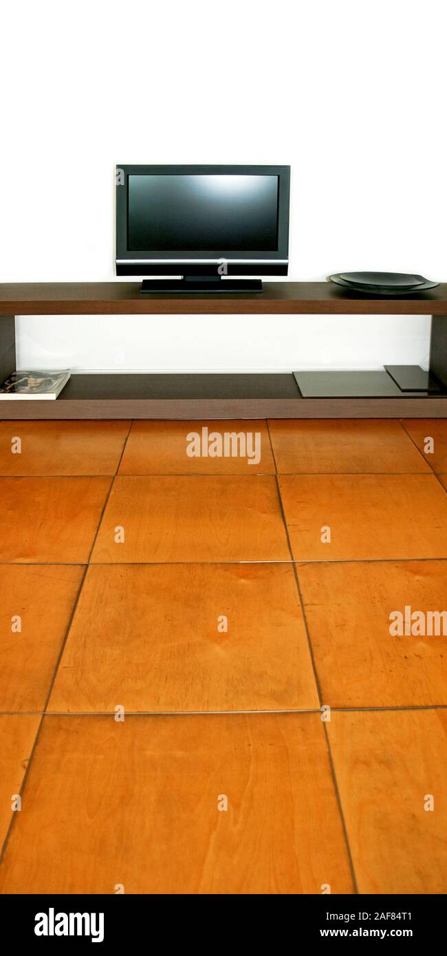 Big LCD TV set with wooden shelf Stock Photo - Alamy