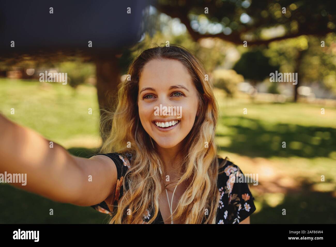 Beautiful blonde woman taking selfie hi-res stock photography and ...