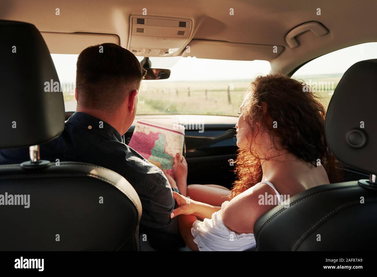 People looking at map in car hi-res stock photography and images - Alamy