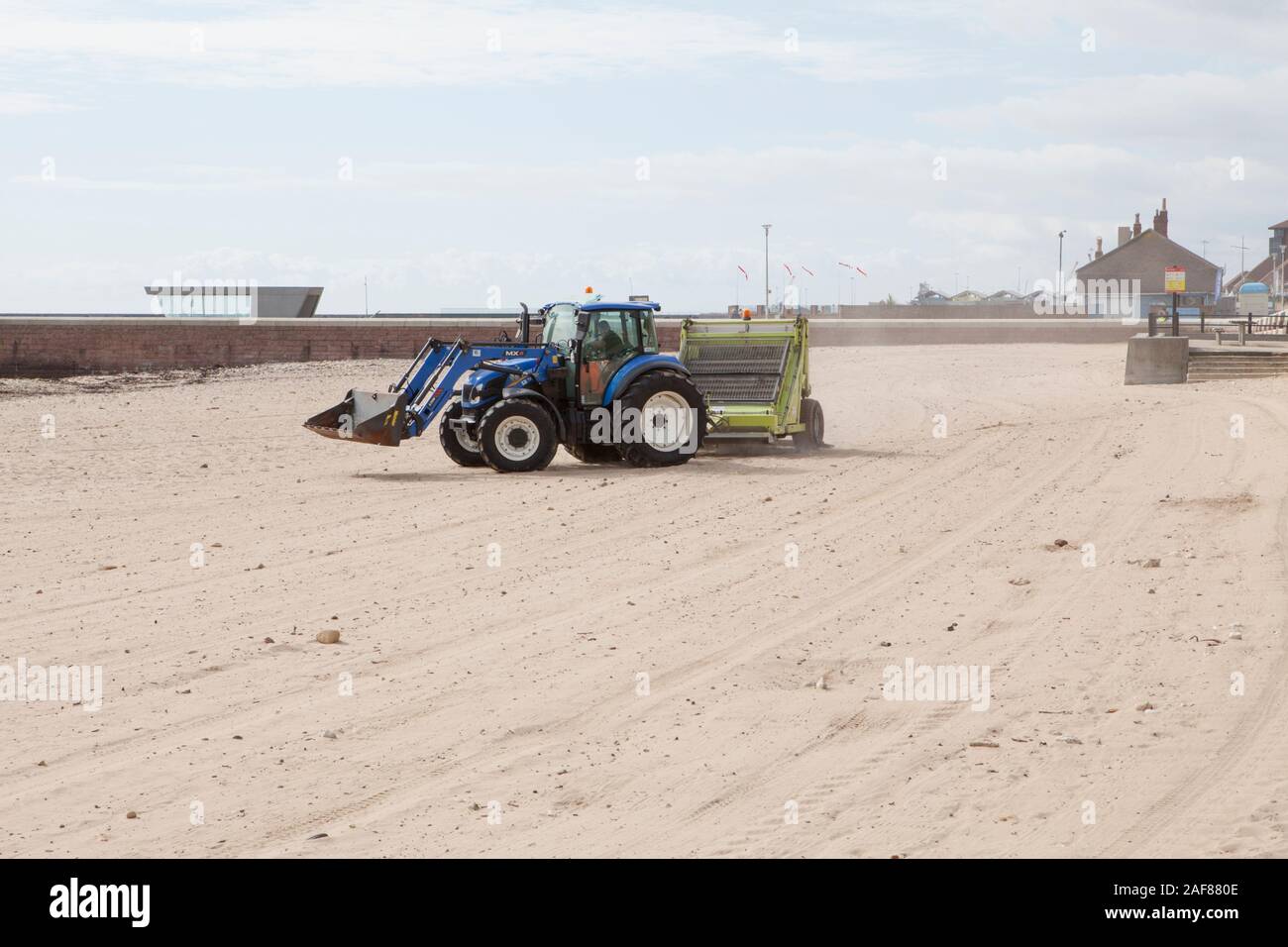 Tractor cleaning beach sand hi-res stock photography and images - Alamy