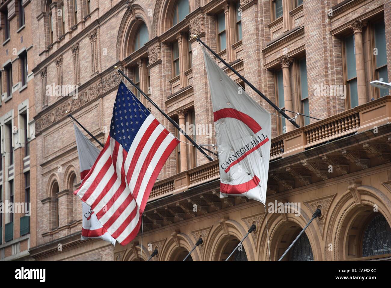 Flags flying outside of Carnegie Hall, New York Stock Photo - Alamy