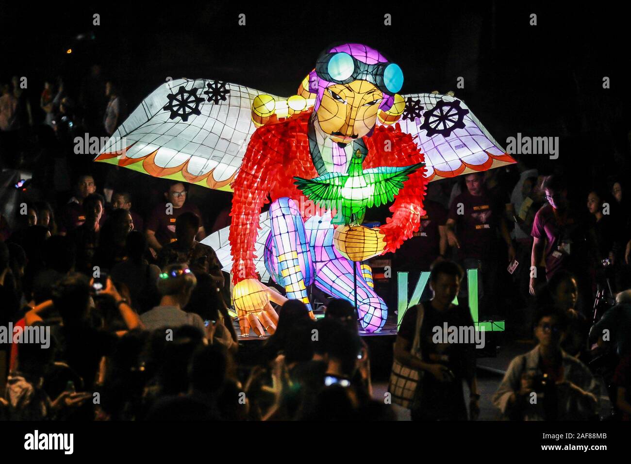 Quezon, Philippines. 13th Dec, 2019. Students march with a parade float ...