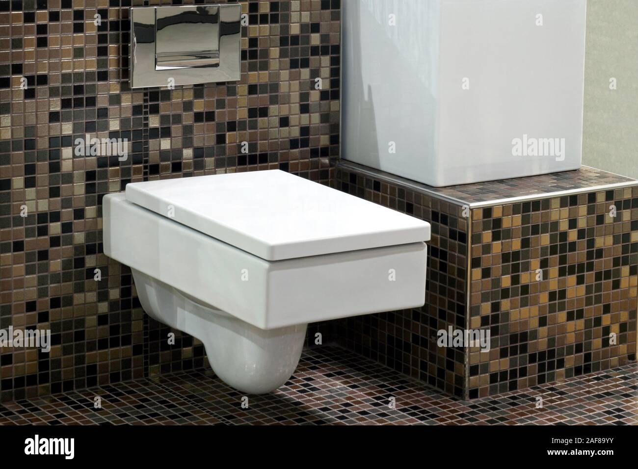 Square shape of geometric toilet and brown tiles Stock Photo - Alamy