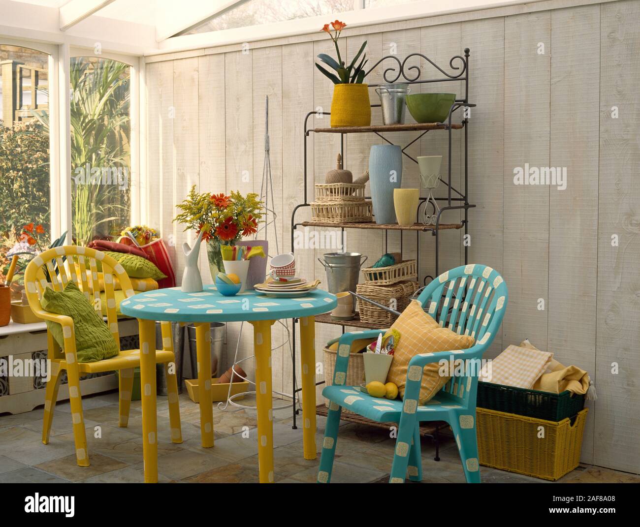 Upcycled old plastic table and chairs Stock Photo - Alamy