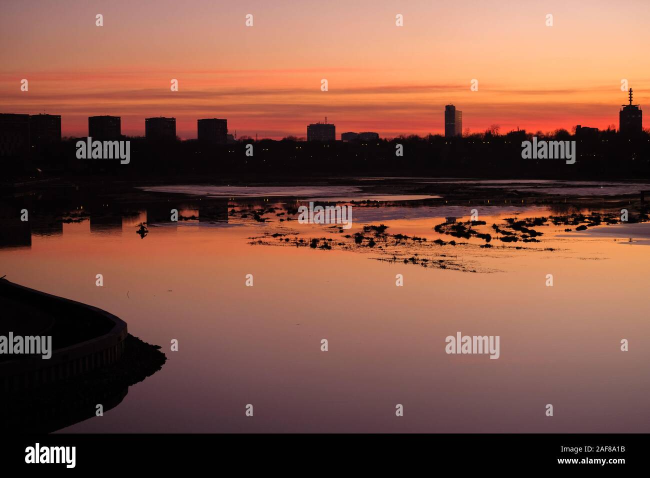 Bucharest skyline seen over the Floreasca lake in sunset light Stock ...