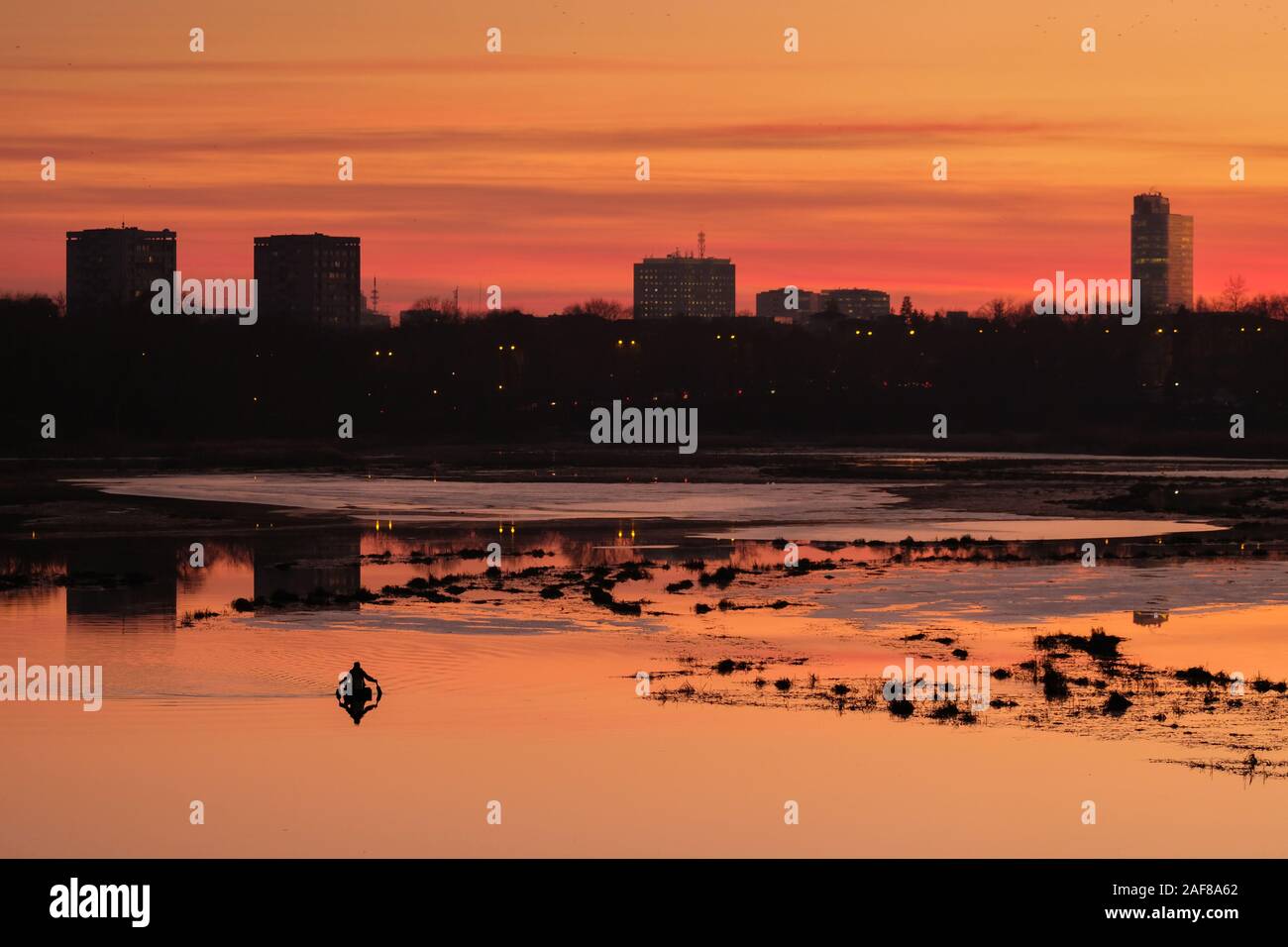 Bucharest skyline seen over the Floreasca lake in sunset light Stock ...