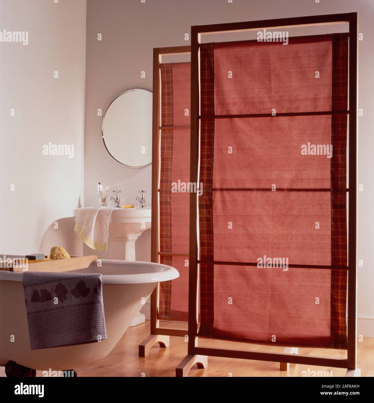 Portable screens used for privacy in bathroom Stock Photo - Alamy